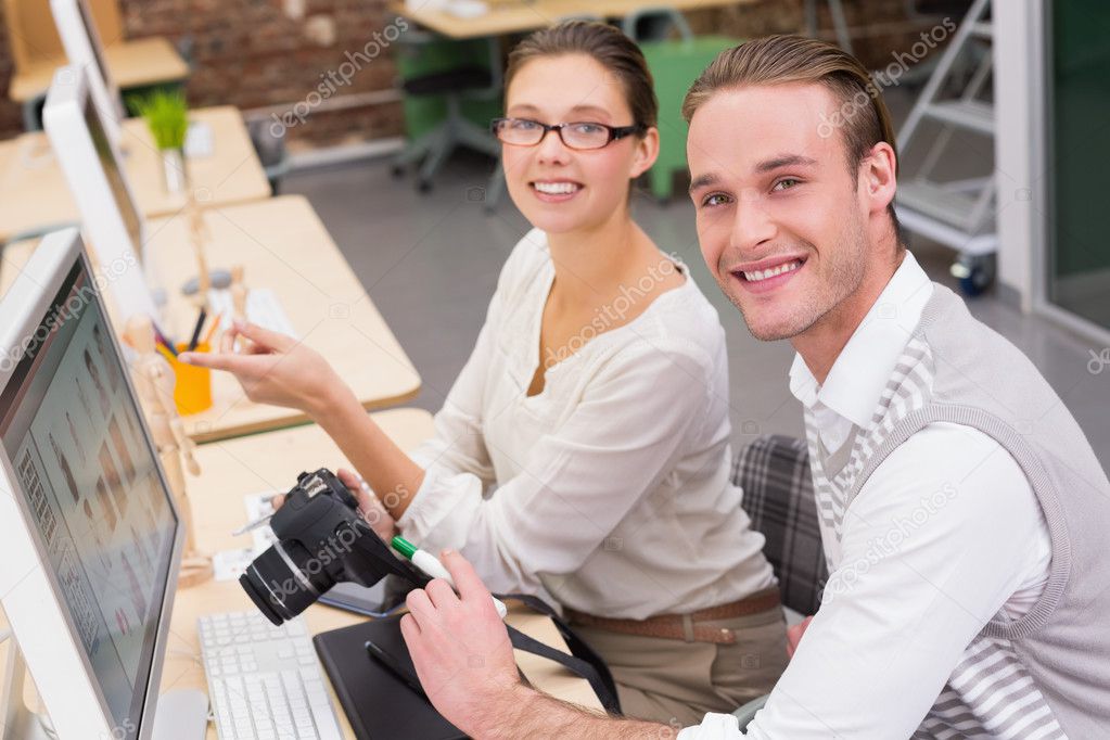 Smiling photo editors using computer in office — Stock Photo ...