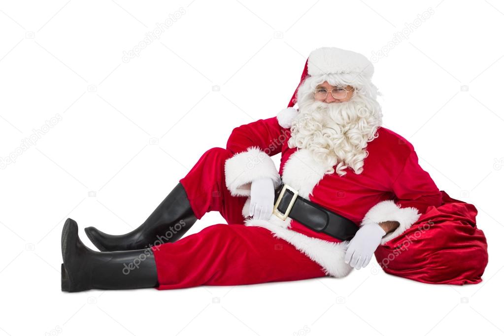 Relaxed santa sitting and leaning on his sack Stock Photo by ...
