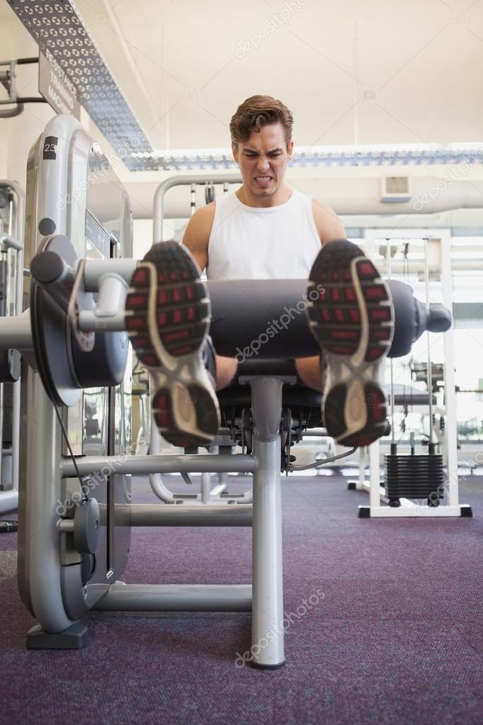 Fit man using weights machine for legs Stock Photo by ©Wavebreakmedia ...