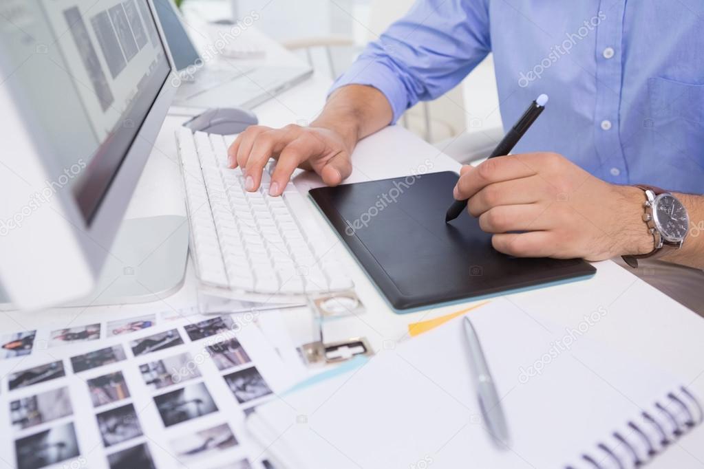 Graphic designer using digitizer at his desk — Stock Photo ...