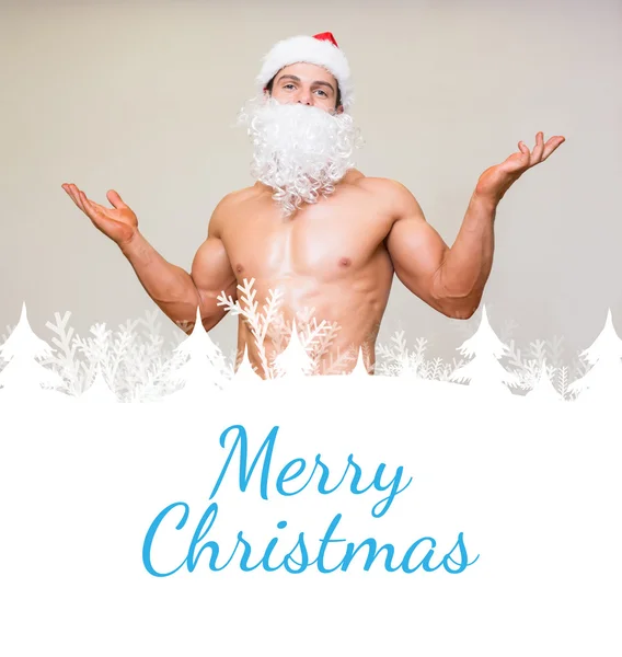 Shirtless macho man in santa hat Stock Photo by ©Wavebreakmedia 62507621