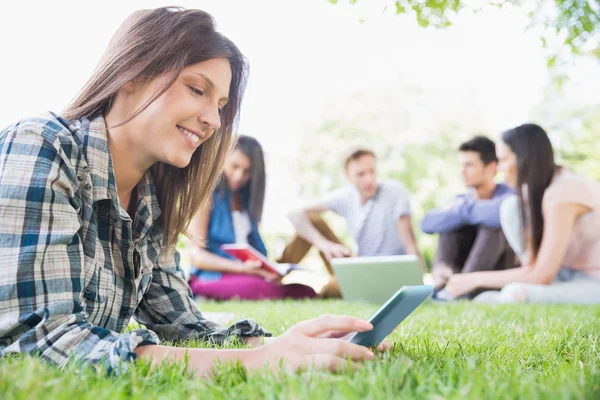 Happy students sitting outside on campus - Stock Image - Everypixel