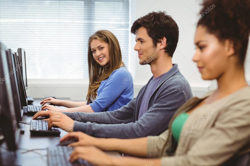 Happy student in computer class smiling at camera — Stock Photo ...