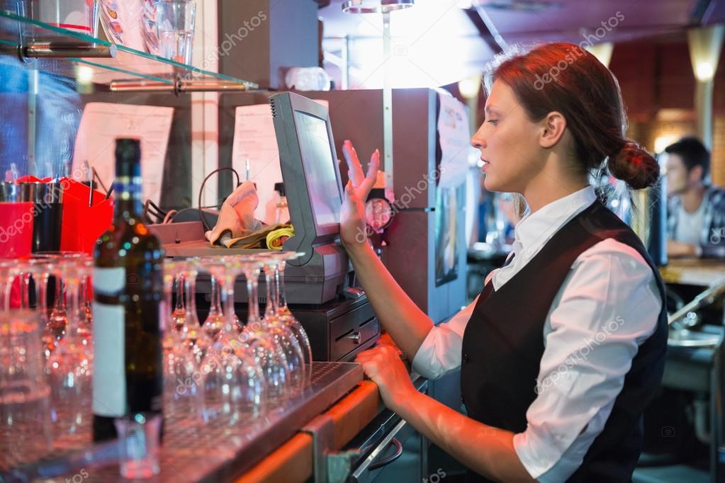Happy barmaid using touchscreen till Stock Photo by ©Wavebreakmedia ...
