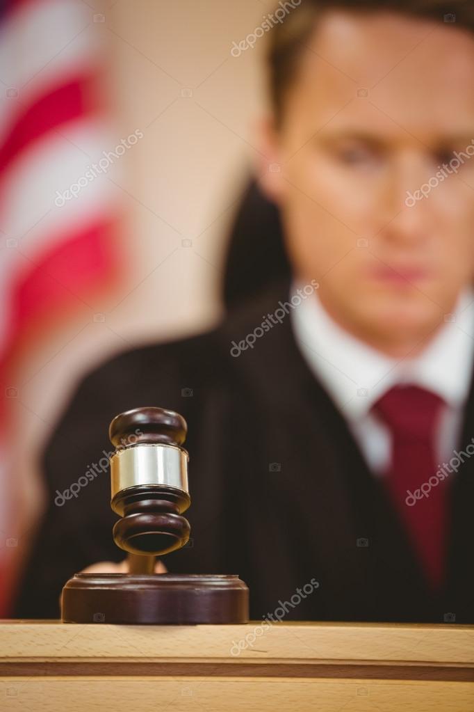 Serious judge about to bang gavel on sounding block — Stock Photo ...