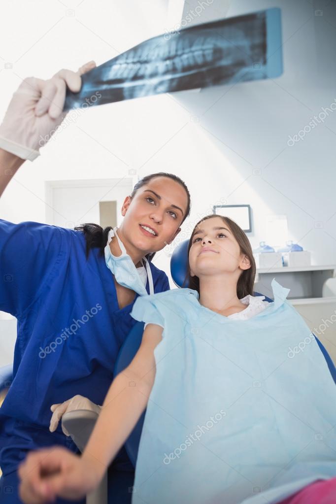 Dentist explaining to young patient the x-ray Stock Photo by ...