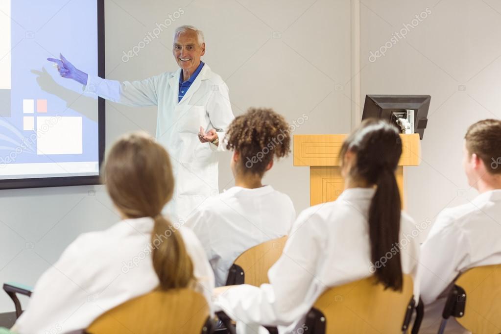 Science professor giving lecture to class Stock Photo by ...