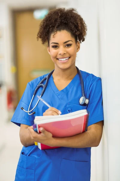 Young medical student taking notes Stock Photo by ©Wavebreakmedia 65280399