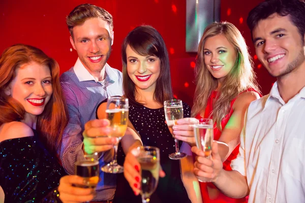 Happy friends on a night out together - Stock Image - Everypixel