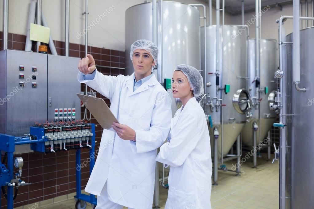 Man pointing at something to his colleague — Stock Photo ...
