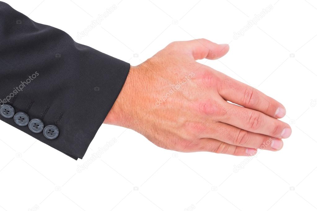 Businessman holding his hand out — Stock Photo © Wavebreakmedia #65553541