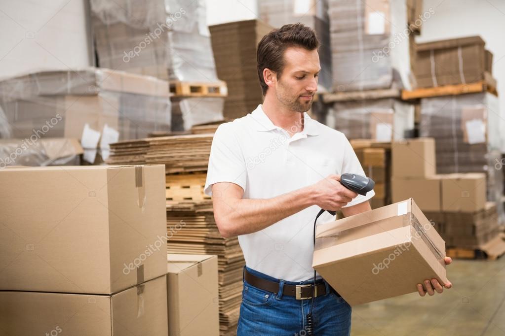 Worker scanning package in warehouse Stock Photo by ©Wavebreakmedia ...