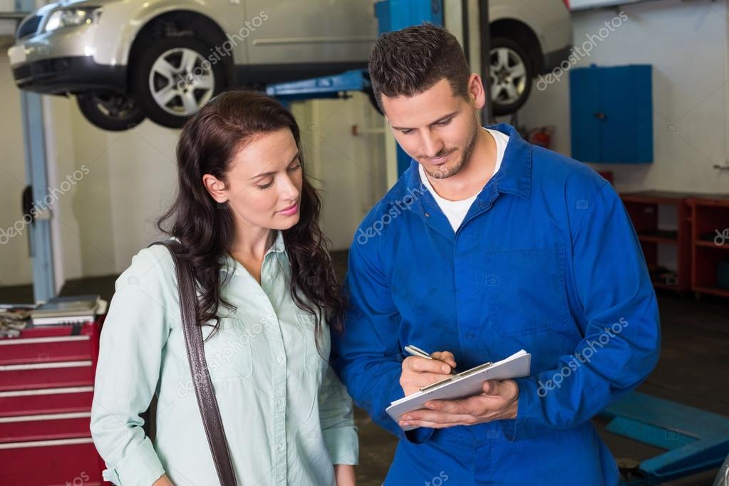 Mechanic and customer talking together — Stock Photo © Wavebreakmedia ...