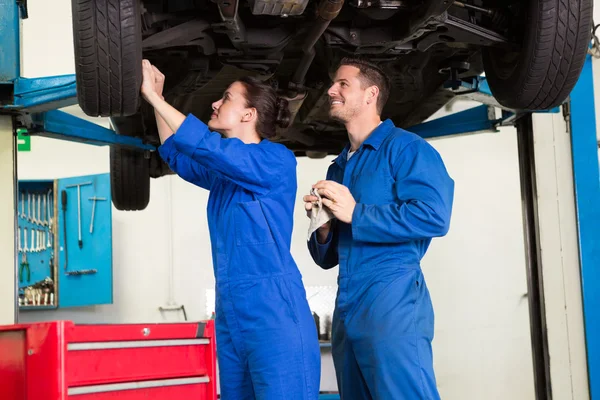 Team of mechanics working together — Stock Photo © Wavebreakmedia #65552953