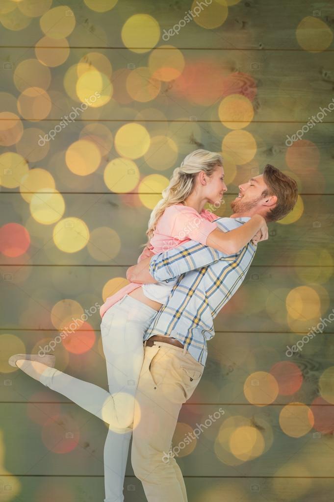 Man picking up and hugging his girlfriend — Stock Photo ...