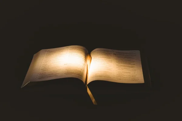 Light shining on open bible Stock Photo by ©Wavebreakmedia 68954403