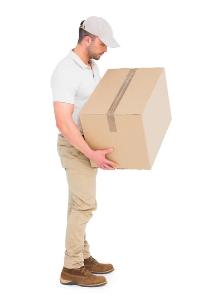 Delivery man holding cardboard box — Stock Photo © Wavebreakmedia #68989401