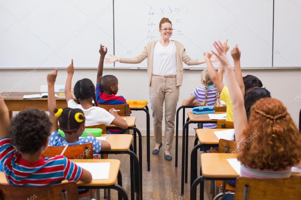 Teacher giving a mathematics lesson in classroom — Stock Photo ...