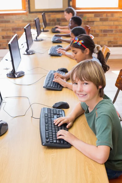 Cute pupils in computer class - Stock Image - Everypixel
