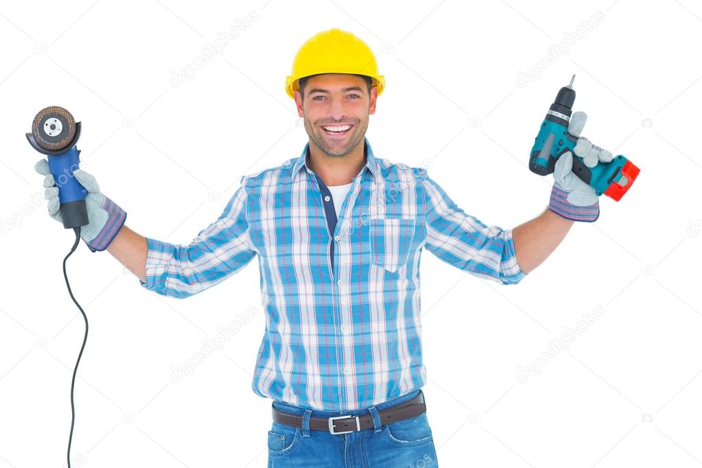 Manual worker holding power tools Stock Photo by ©Wavebreakmedia 68994965