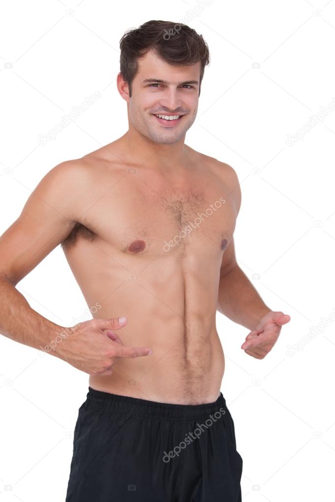 Apto homem sem camisa sorrindo para a câmera fotos, imagens de ...