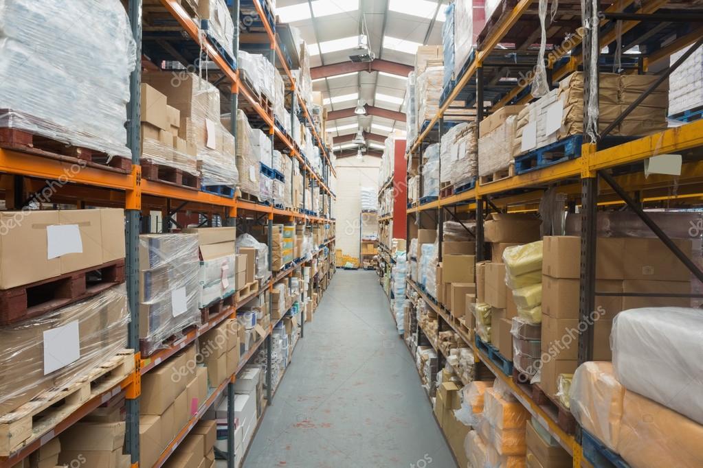 Shelves with boxes in warehouse — Stock Photo © Wavebreakmedia #69020741