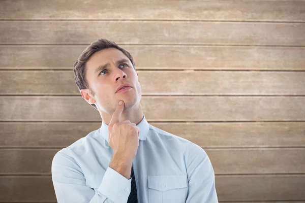 Thinking businessman with finger on chin - Stock Image - Everypixel