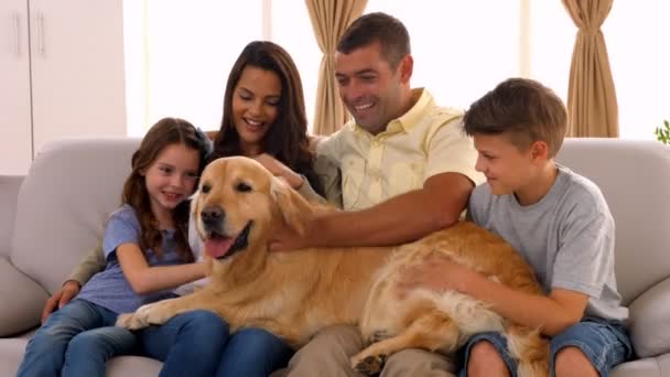 Golden Retriever with family at home Stock Photo by ©Wavebreakmedia ...