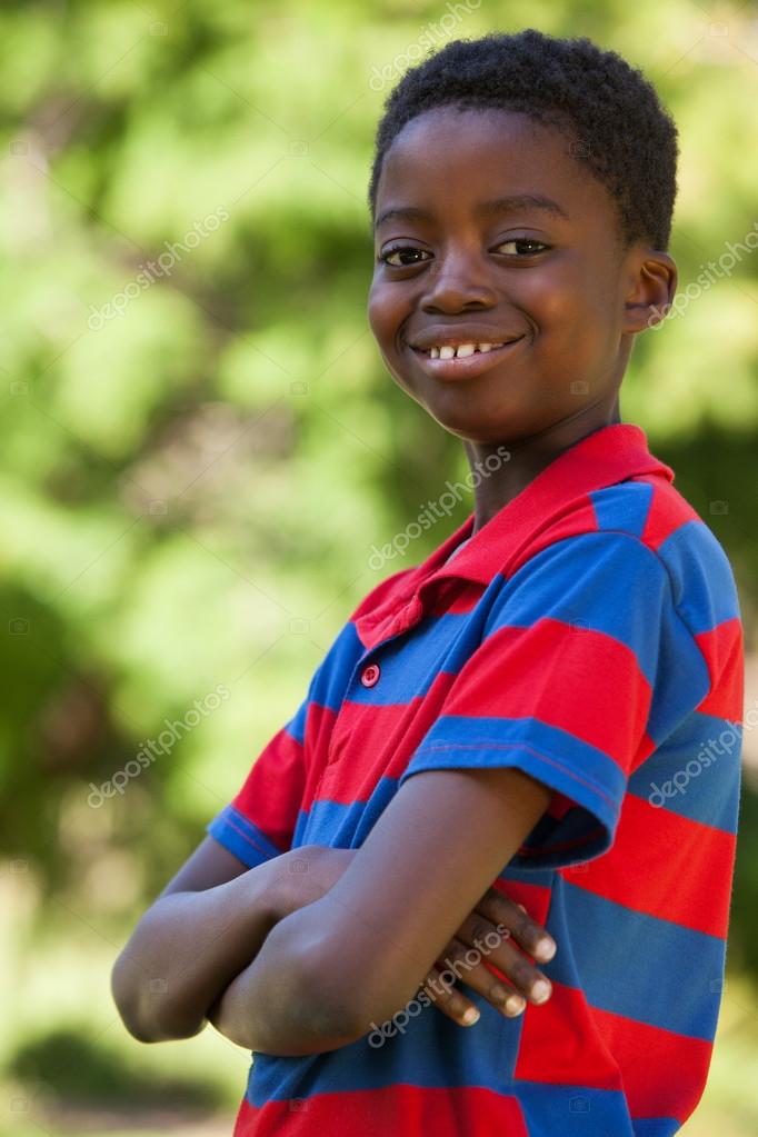 Cute little boy smiling at camera — Stock Photo © Wavebreakmedia #73273447