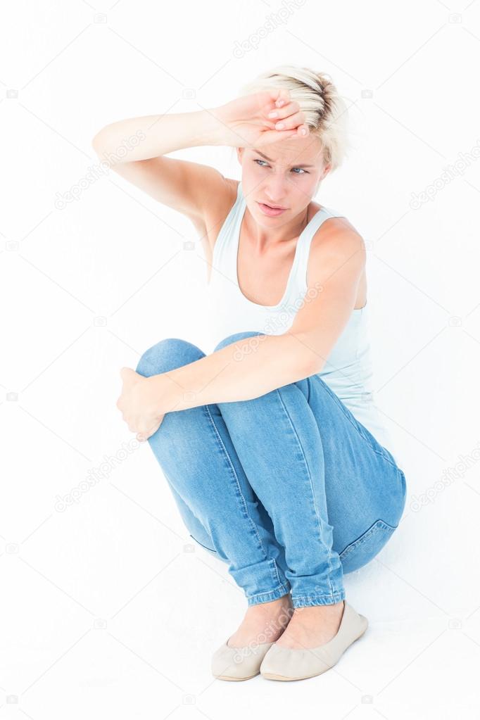 Crouching sad woman holding her hand Stock Photo by ©Wavebreakmedia ...