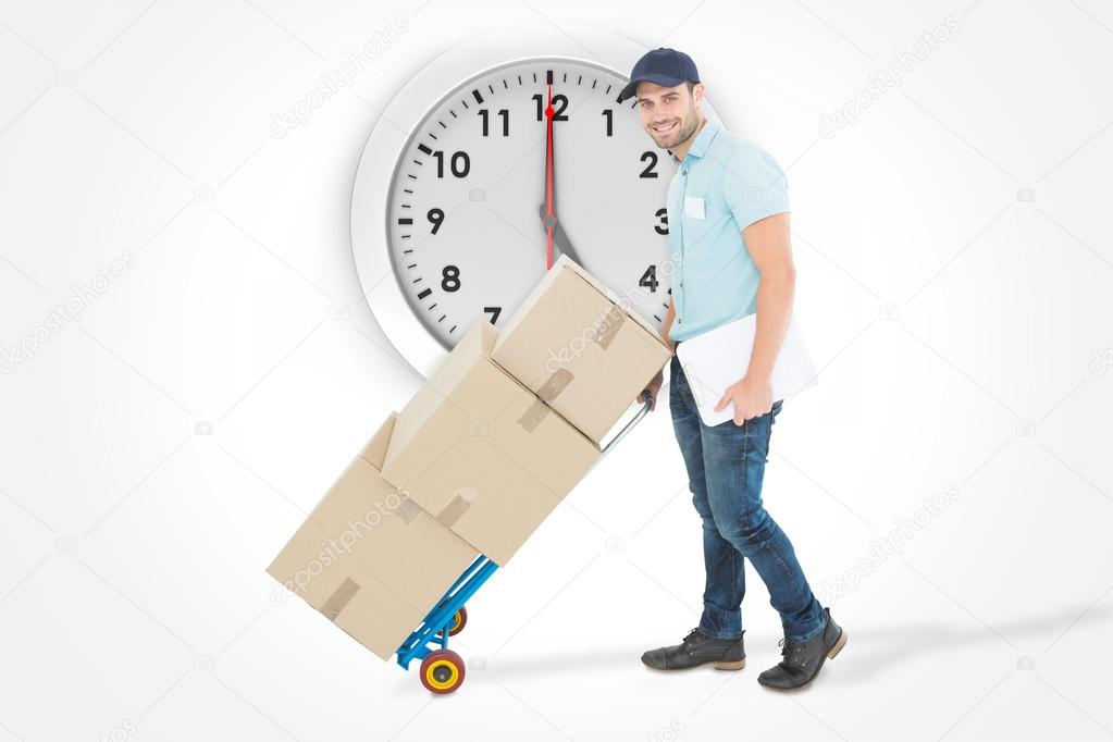 Delivery man pushing trolley of boxes — Stock Photo © Wavebreakmedia ...