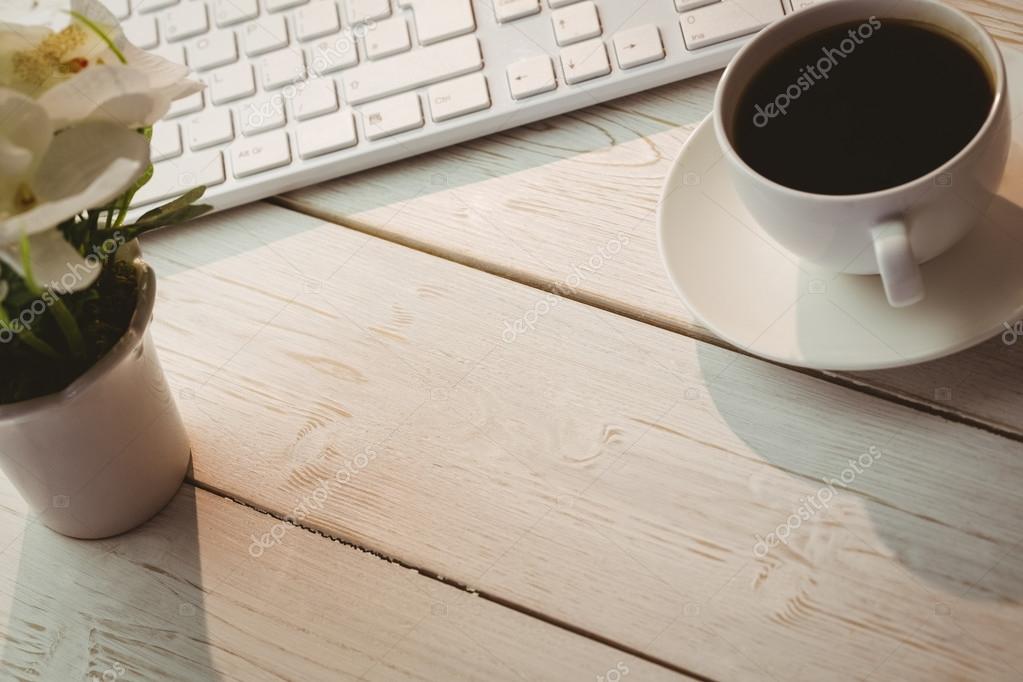 White keyboard and cup of coffee — Stock Photo © Wavebreakmedia #76341787