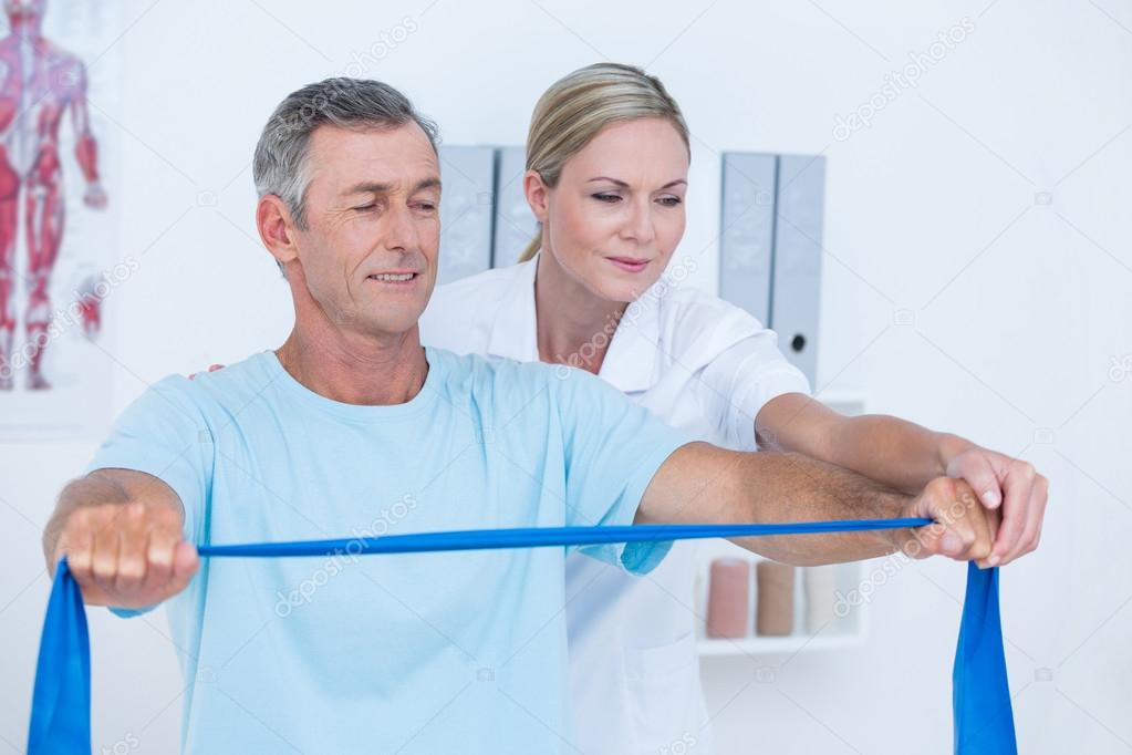 Doctor examining her patient back — Stock Photo © Wavebreakmedia #76342161