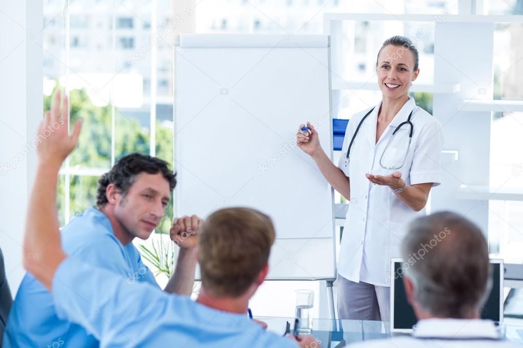 Doctors having brainstorming session Stock Photo by ©Wavebreakmedia ...