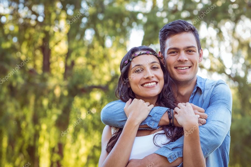 Cute couple smiling in the park — Stock Photo © Wavebreakmedia #76432935