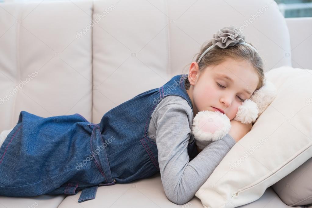 Girl napping on couch — Stock Photo © Wavebreakmedia #81735224
