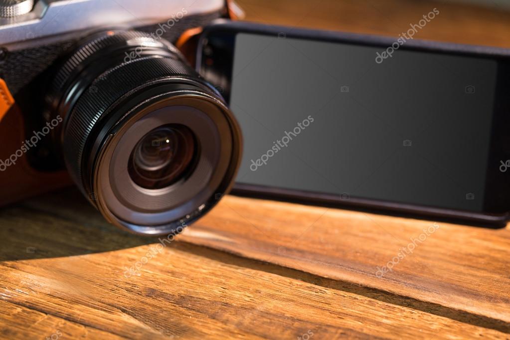 Beautiful brown fashioned camera next smartphone — Stock Photo ...