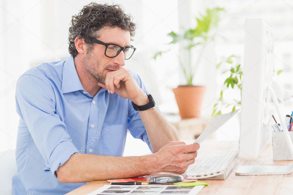 Casual businessman using computer in office — Stock Photo ... Casual businessman using computer in office — Stock Photo ...
