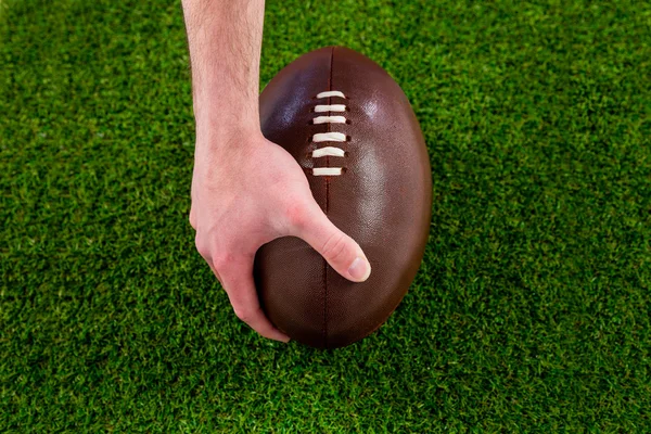 Player preparing for a drop kick Stock Photo by ©Wavebreakmedia 84466280