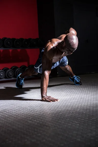 Young Bodybuilder doing One-armed push ups - Stock Image - Everypixel