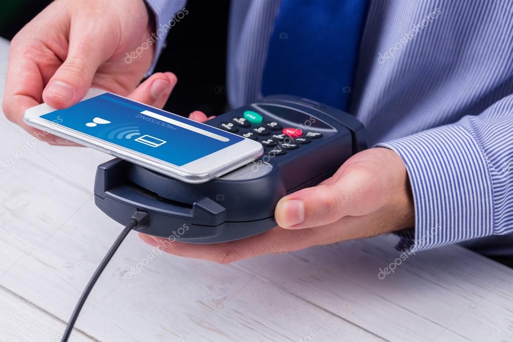 Man using smartphone to express pay — Stock Photo © Wavebreakmedia ...