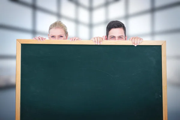 Man and woman showing card - Stock Image - Everypixel