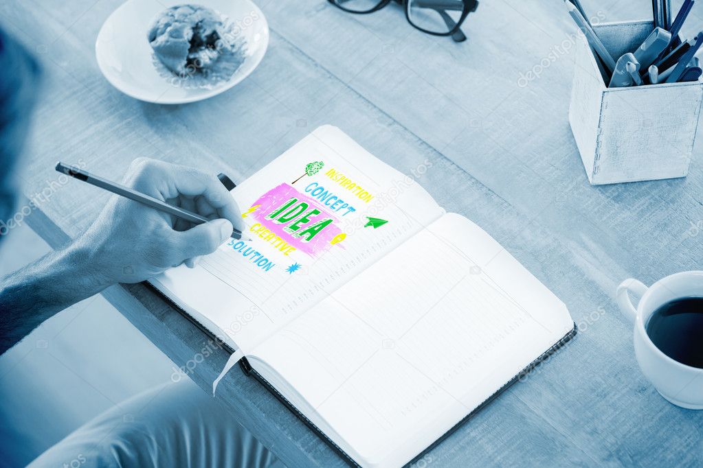 Man writing notes on diary Stock Photo by ©Wavebreakmedia 84423246