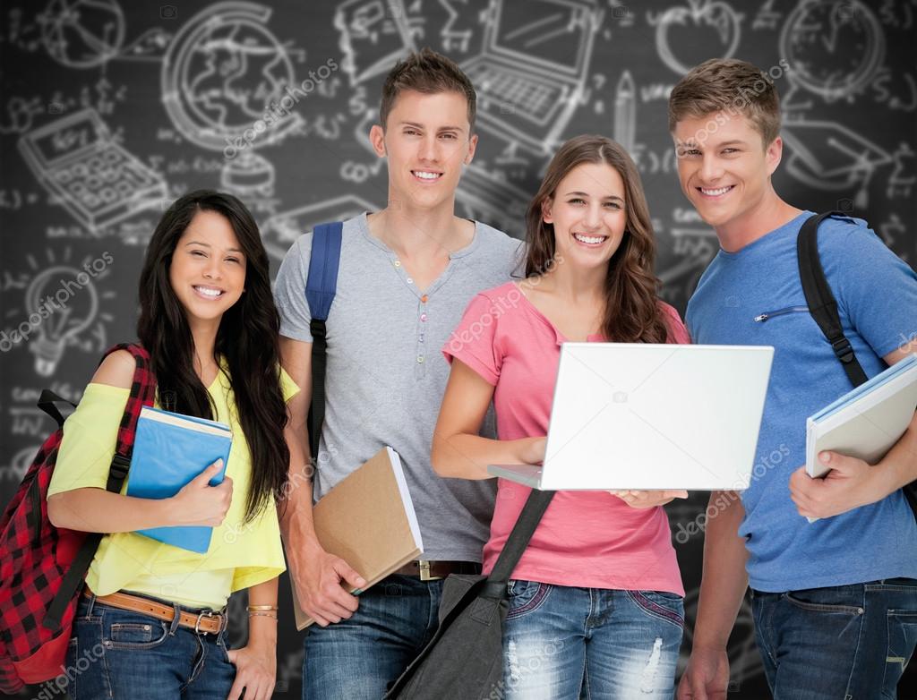 Group of students holding a laptop Stock Photo by ©Wavebreakmedia 84425306