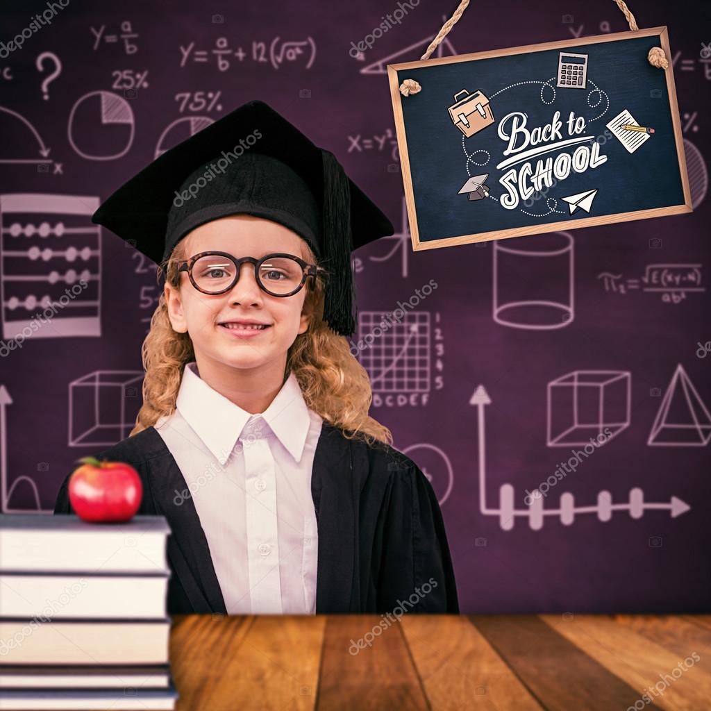 Cute pupil in graduation robe Stock Photo by ©Wavebreakmedia 84427272