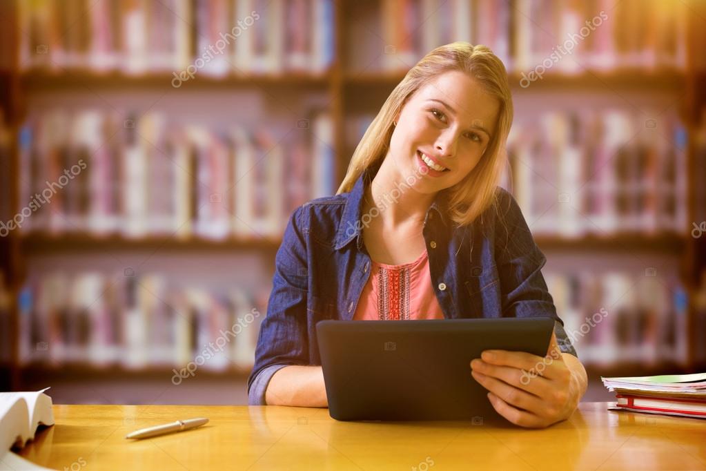 Student studying in the library Stock Photo by ©Wavebreakmedia 84427932