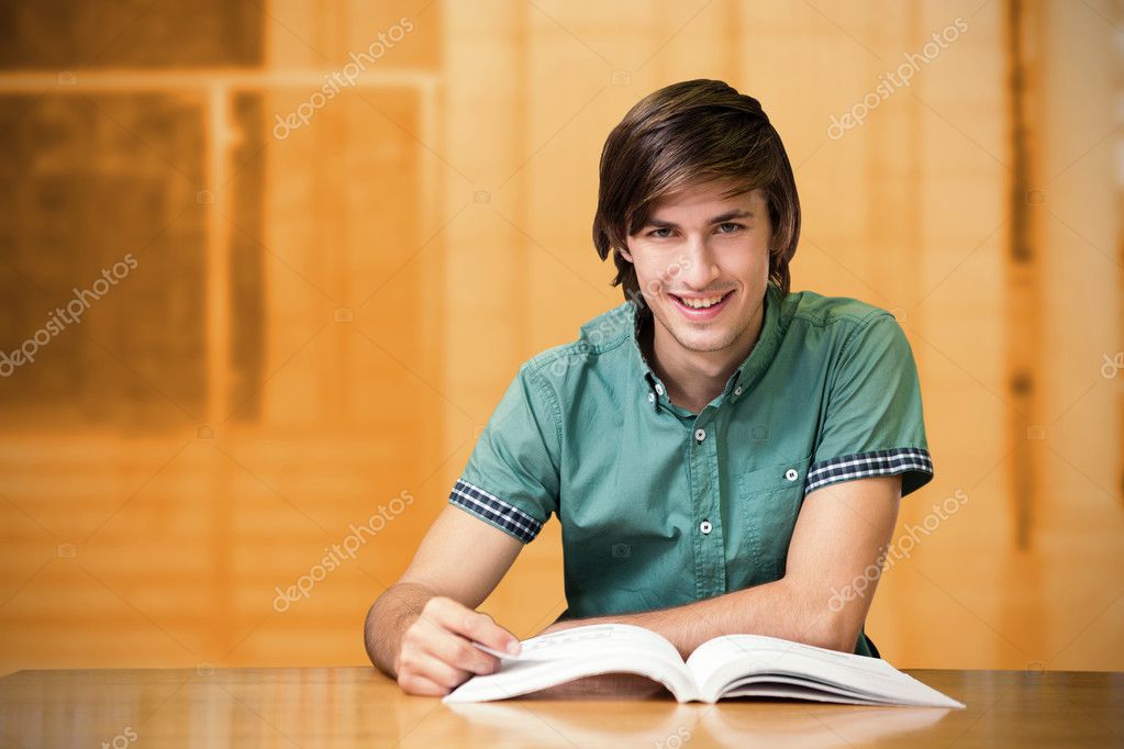 Student sitting in library reading — Stock Photo © Wavebreakmedia #84429066