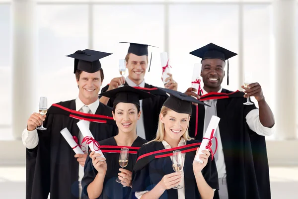 Young woman Graduating holding her Diploma Stock Photo by ...