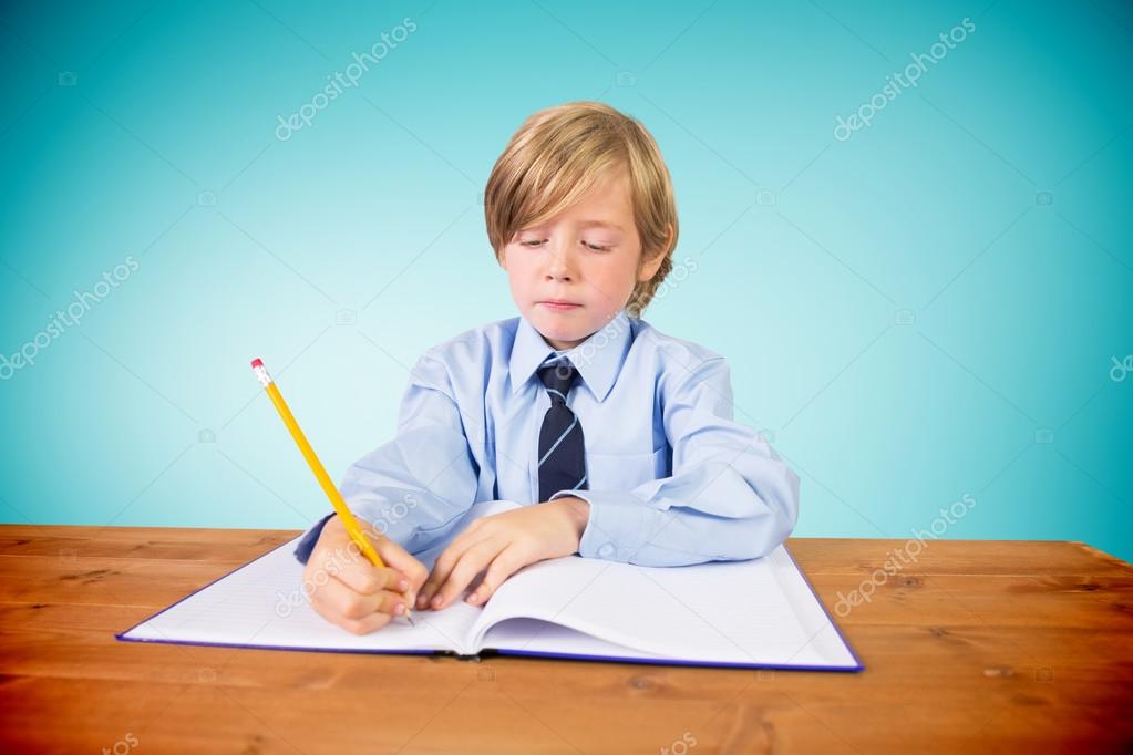 Cute pupil writing Stock Photo by ©Wavebreakmedia 84430242