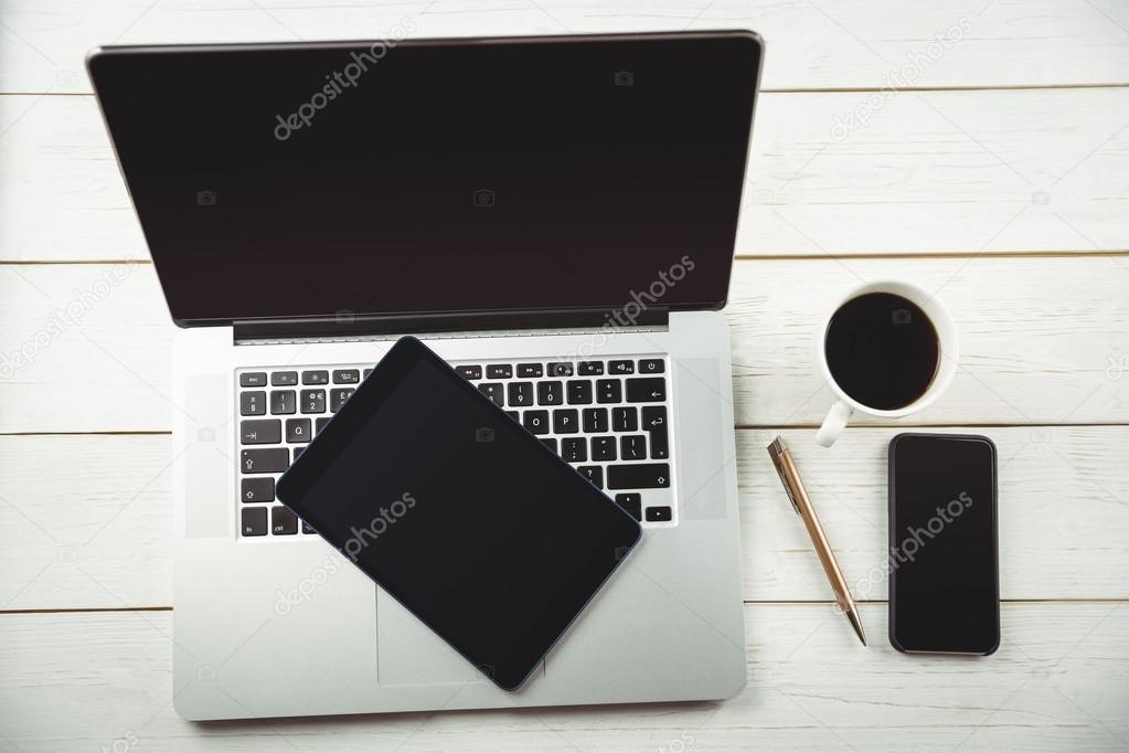 Desk with electronic devices Stock Photo by ©Wavebreakmedia 84465882